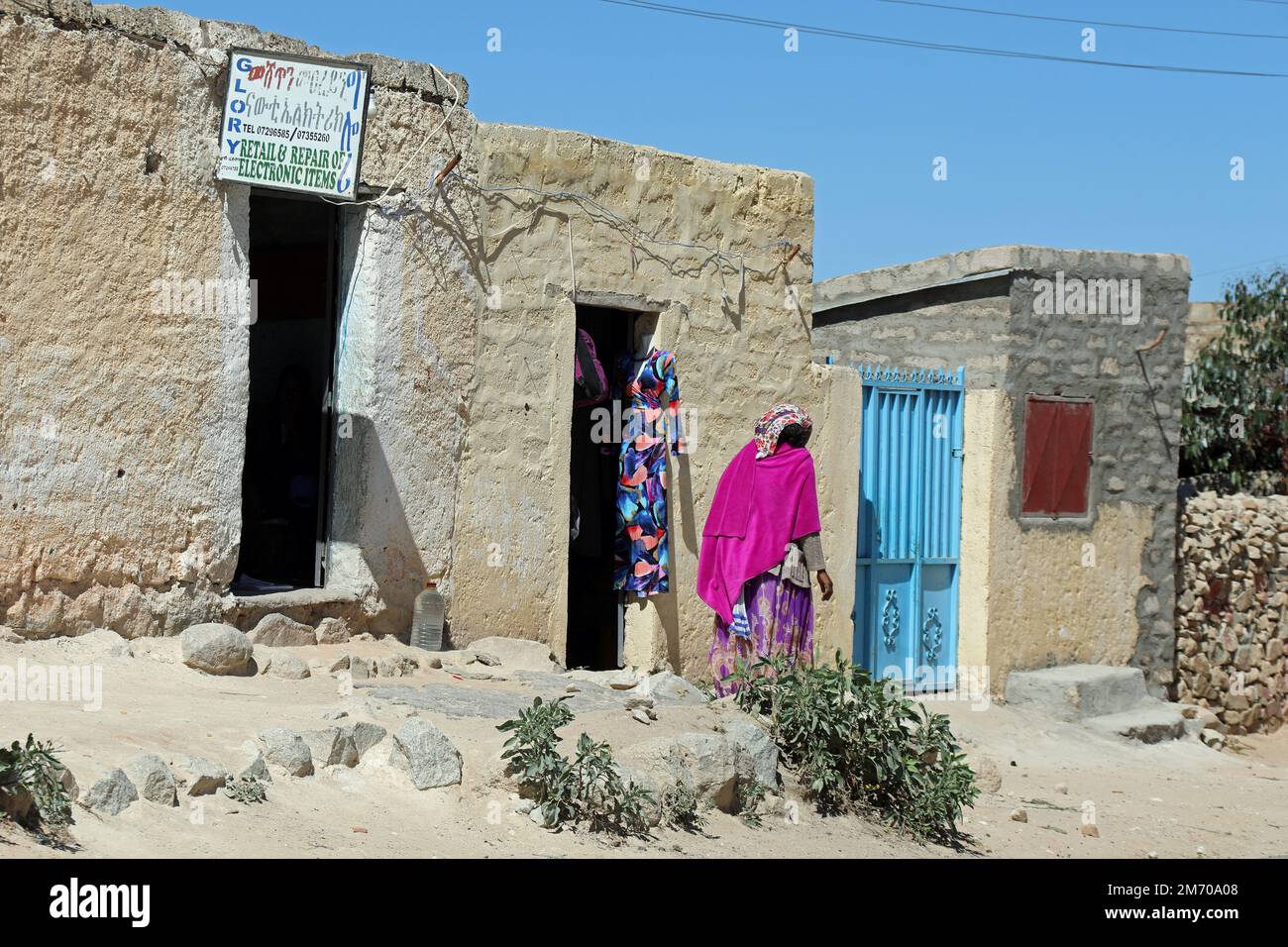 Retail and repair of electronic items store and clothing shop in an Eritrean village Stock Photo ...