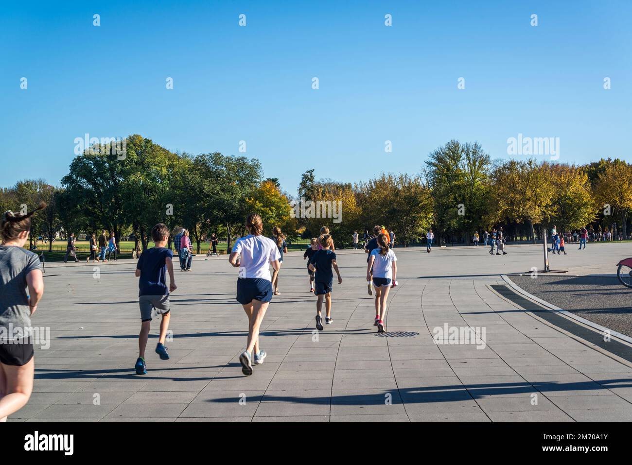 Children running in an exercise class in front of the Lincoln Memorial ...