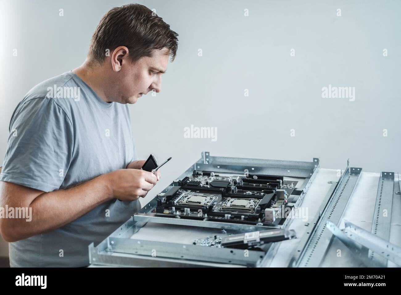 Man engineer,collector.Independent self computer assembly. Mounting socket processor,random ...