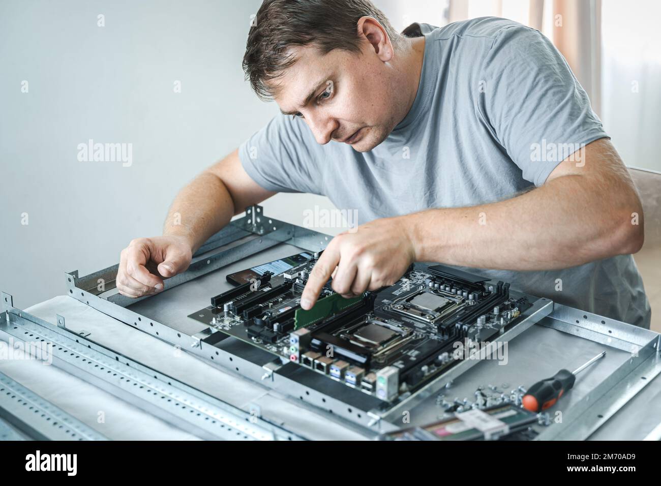 Man engineer,collector.Independent self computer assembly. Mounting ...