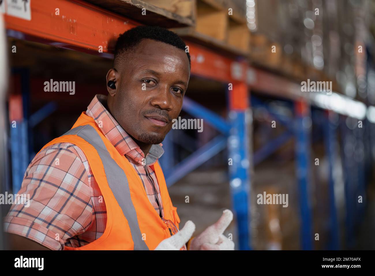 Worker in depot storage warehouse check scan barcode goods box and ...