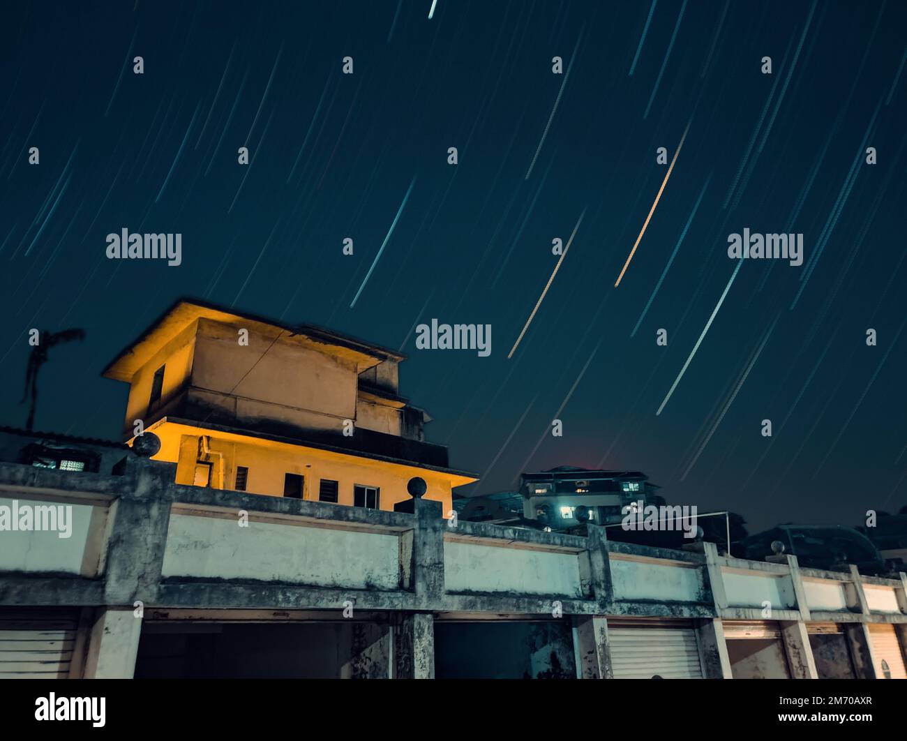 A low angle shot of old buildings in the suburbs of a city during rain ...