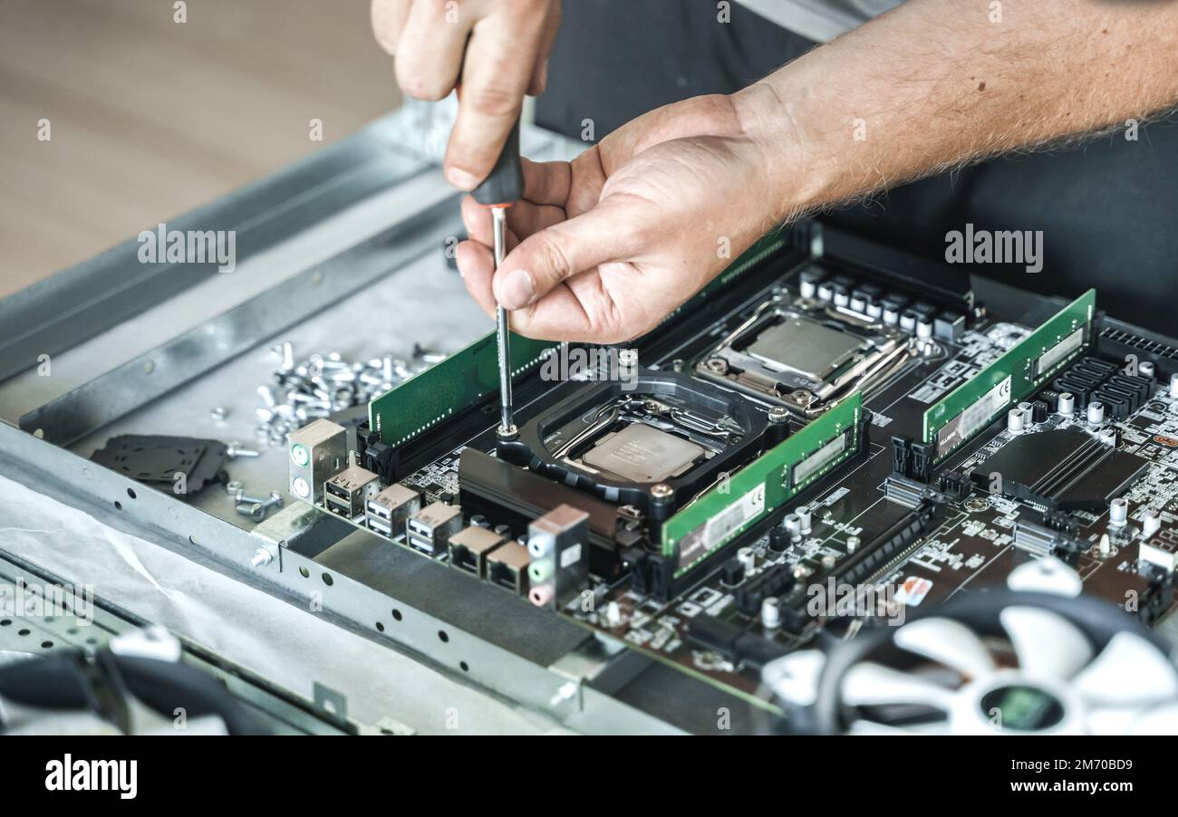 Man engineer,collector.Independent self computer assembly. Mounting socket processor,random ...