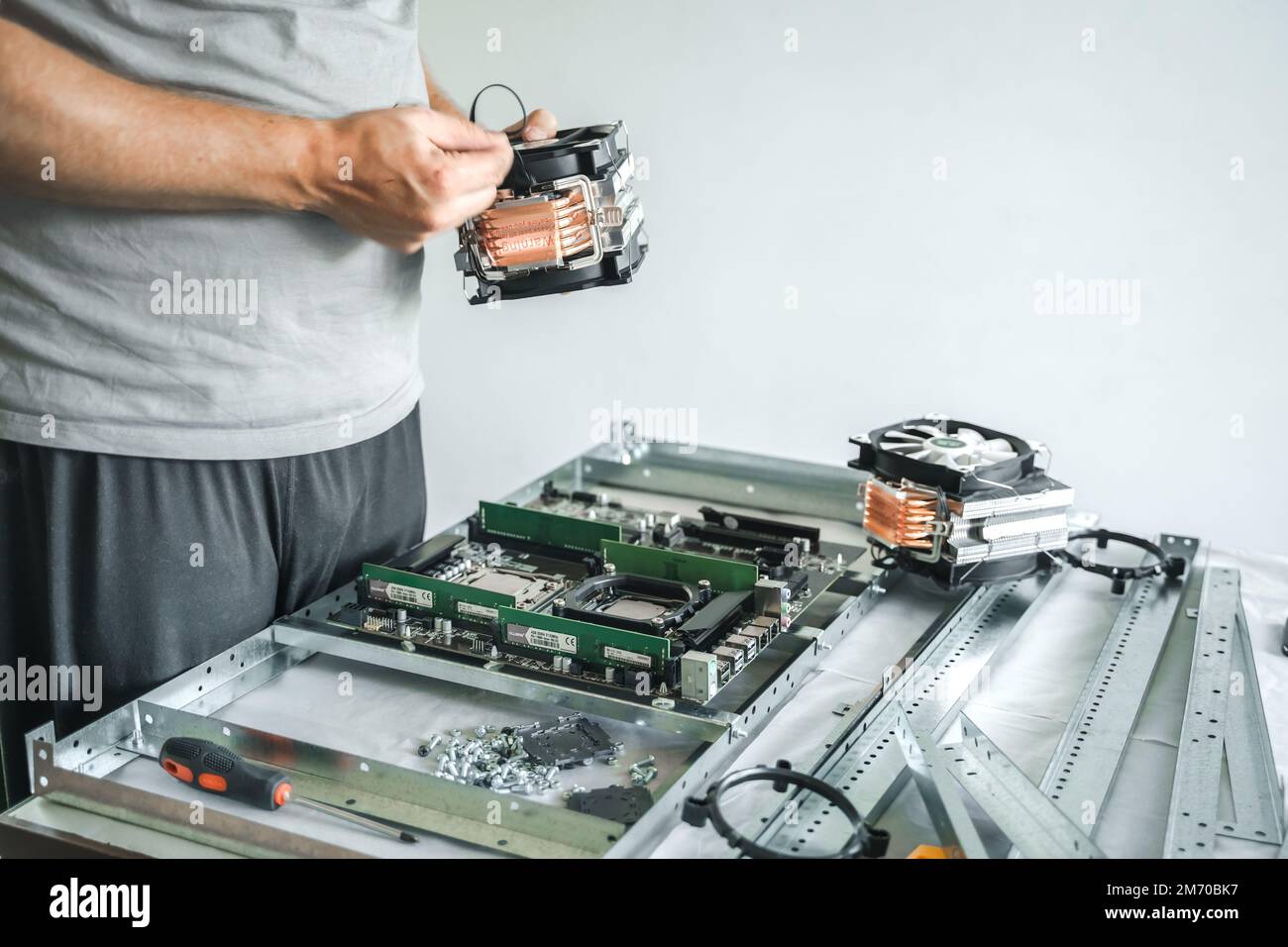 Man engineer,collector.Independent self computer assembly. Mounting socket processor,random ...