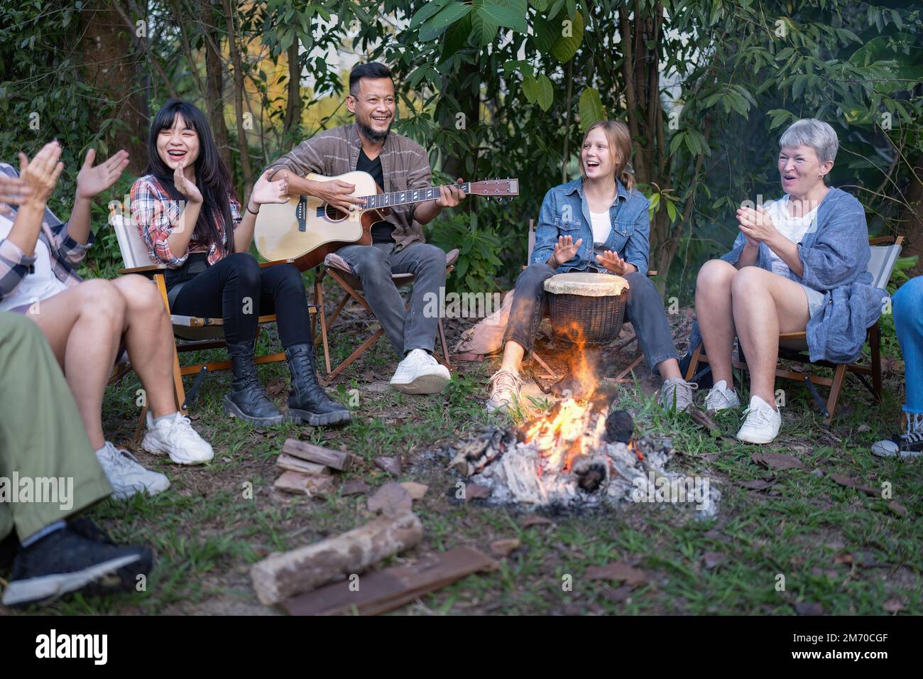 Backpack tourist travel hiking outdoor adventure sit around campfire ...