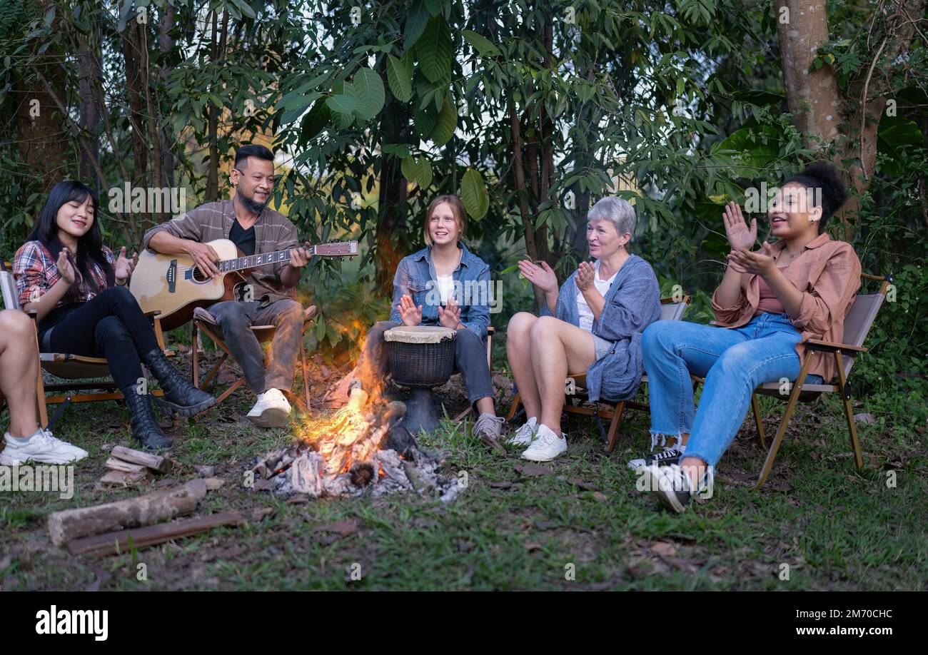 Backpack tourist travel hiking outdoor adventure sit around campfire ...