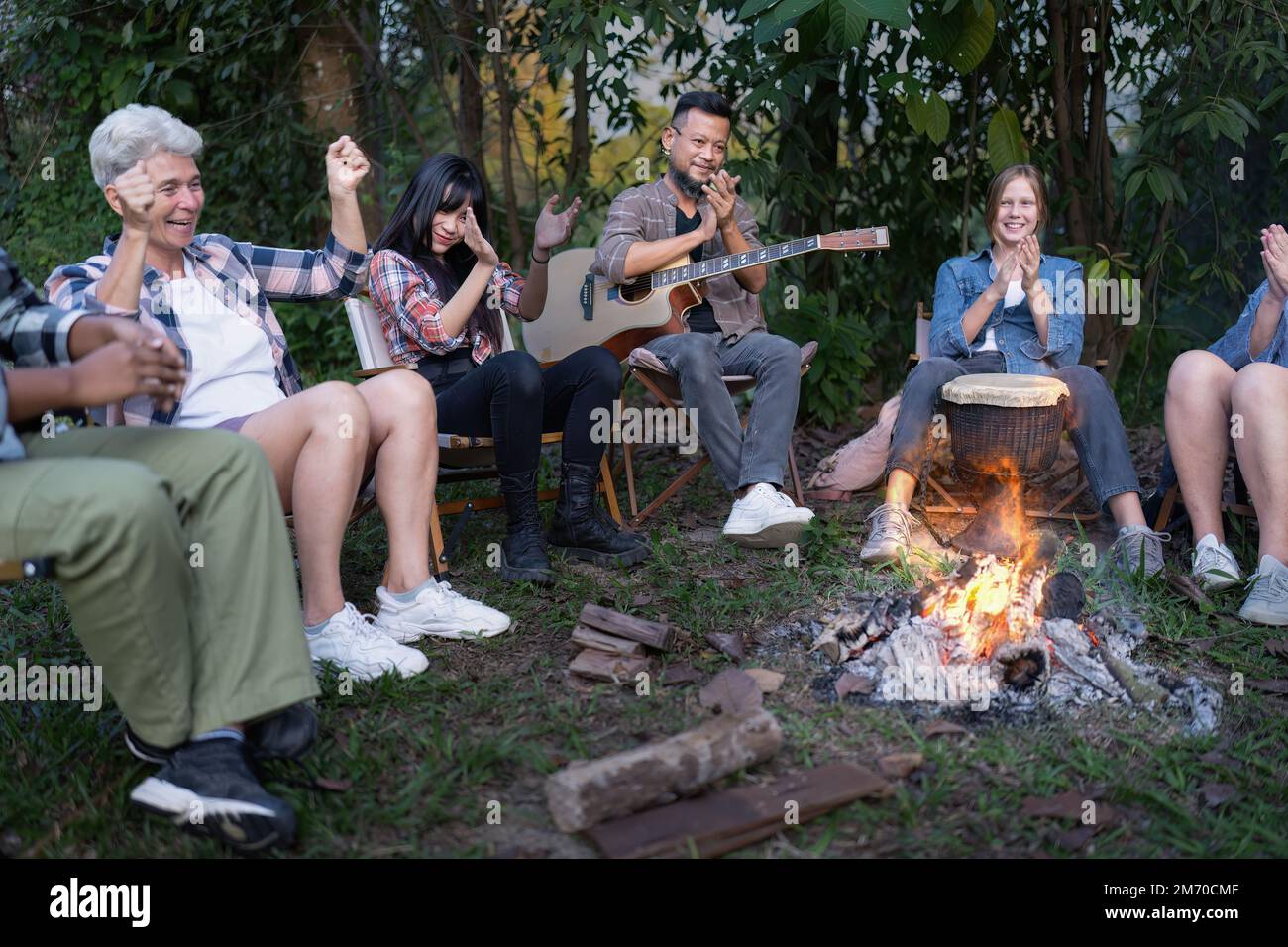 Backpack tourist travel hiking outdoor adventure sit around campfire ...