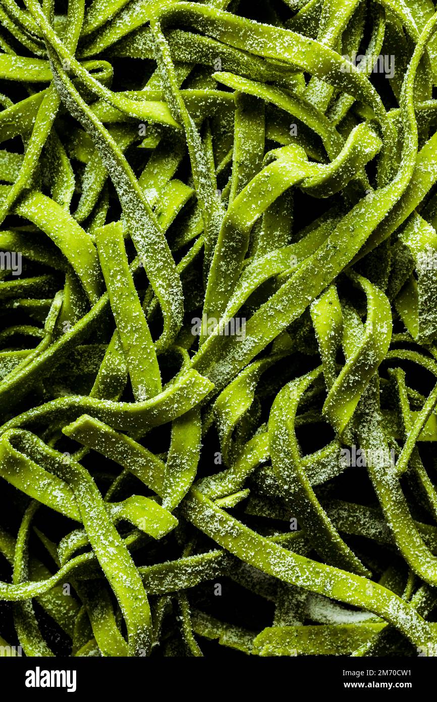 Green spinach tagliatelle pattern background Stock Photo - Alamy