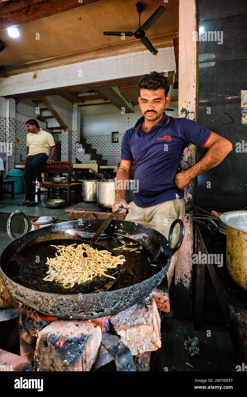 Pushkar, India - November 7, 2019: Indian cook makes fresh street food ...