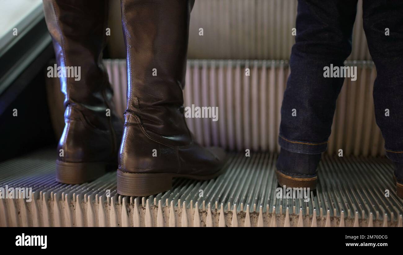 Close-up mother and toddler feet standing in automatic elevator Stock ...