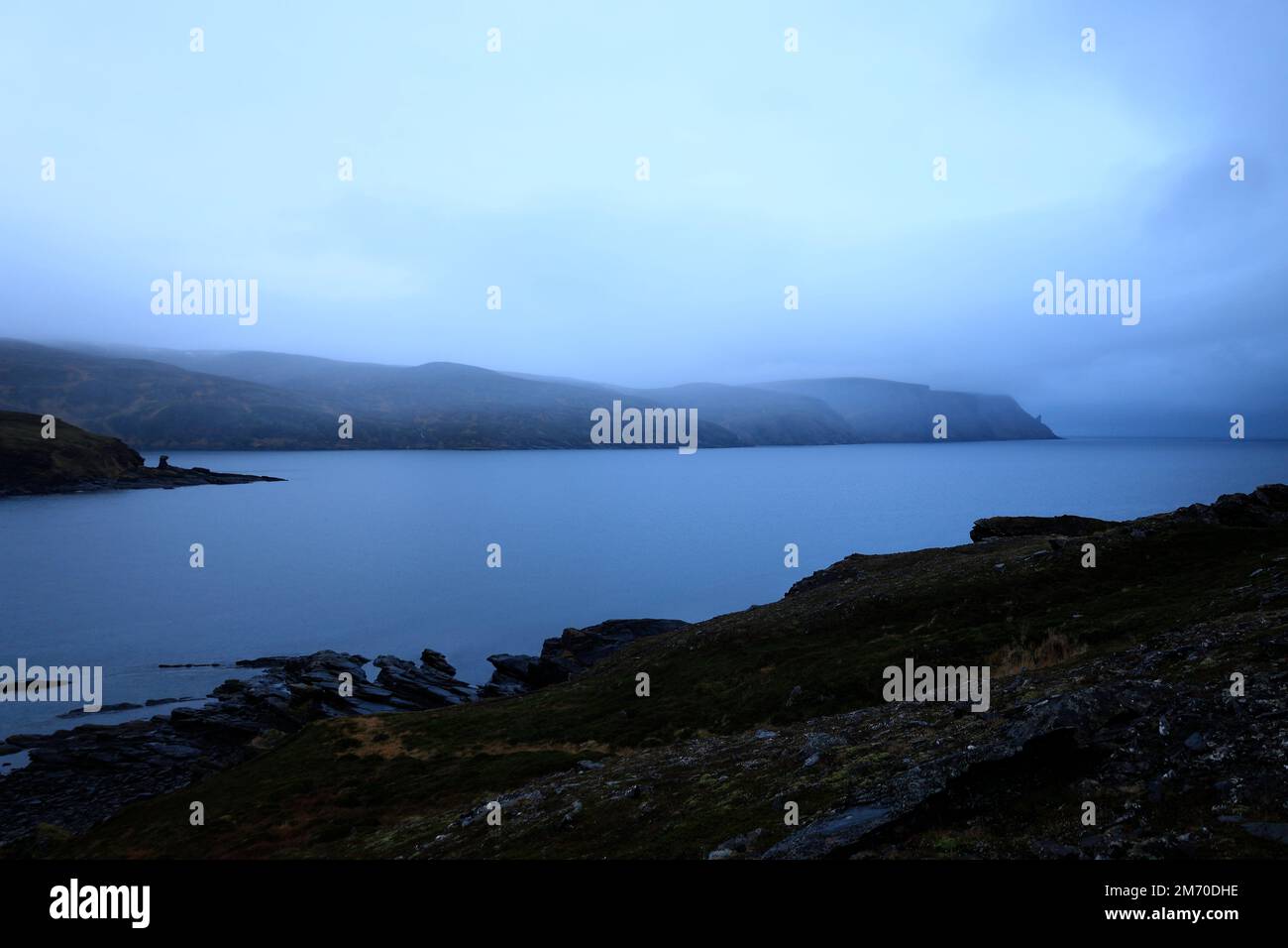 View over the Vestfjord from the North Cape plateau shrouded in clouds ...