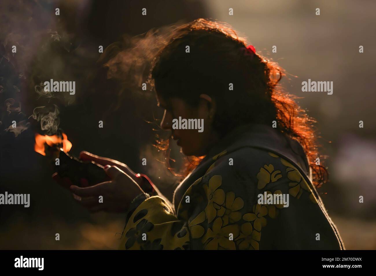 Hindu devotee offers prayers next to the Shali river during the ...
