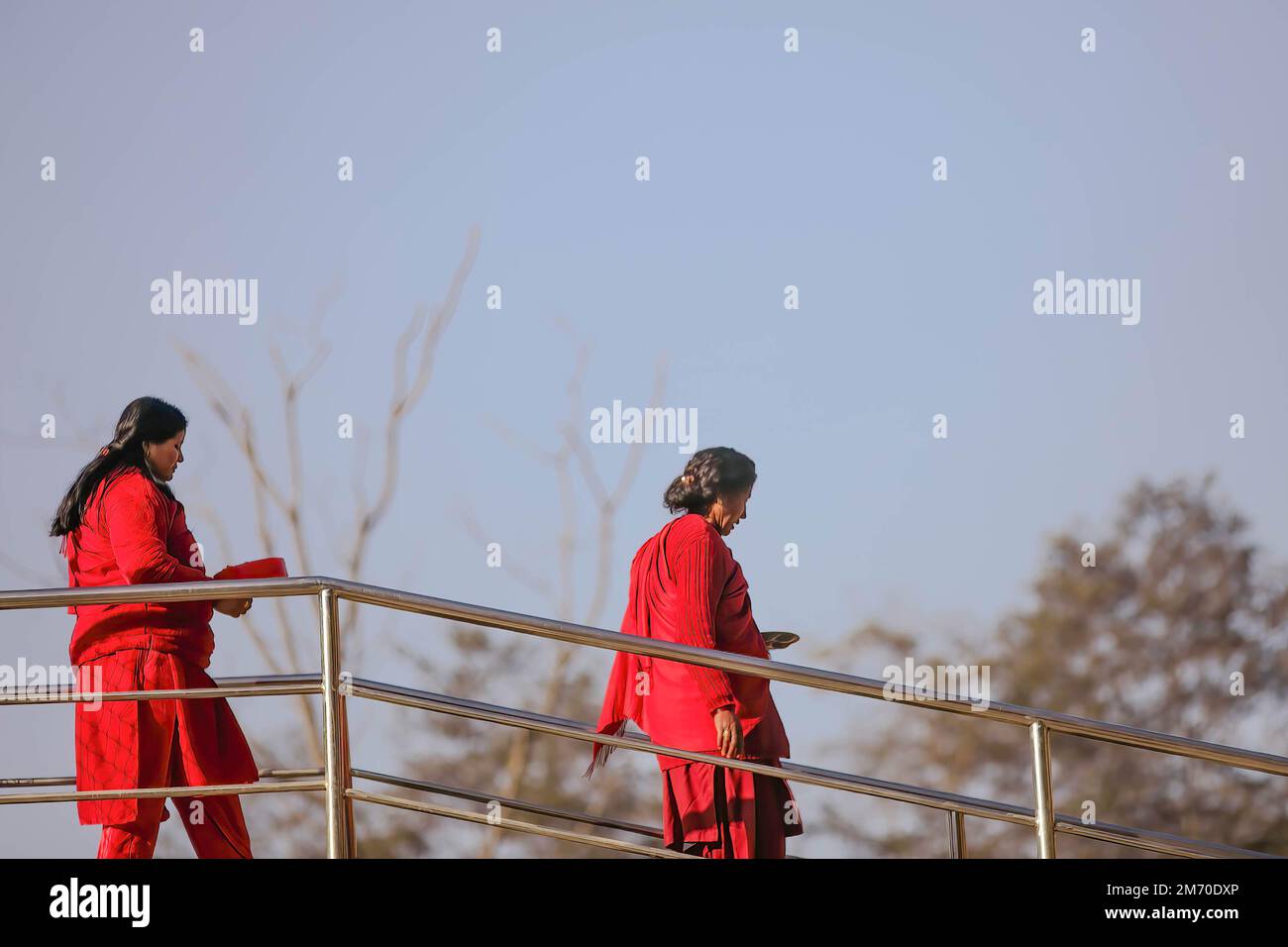 Hindu devotees walk next to the Shali River during the first day of ...
