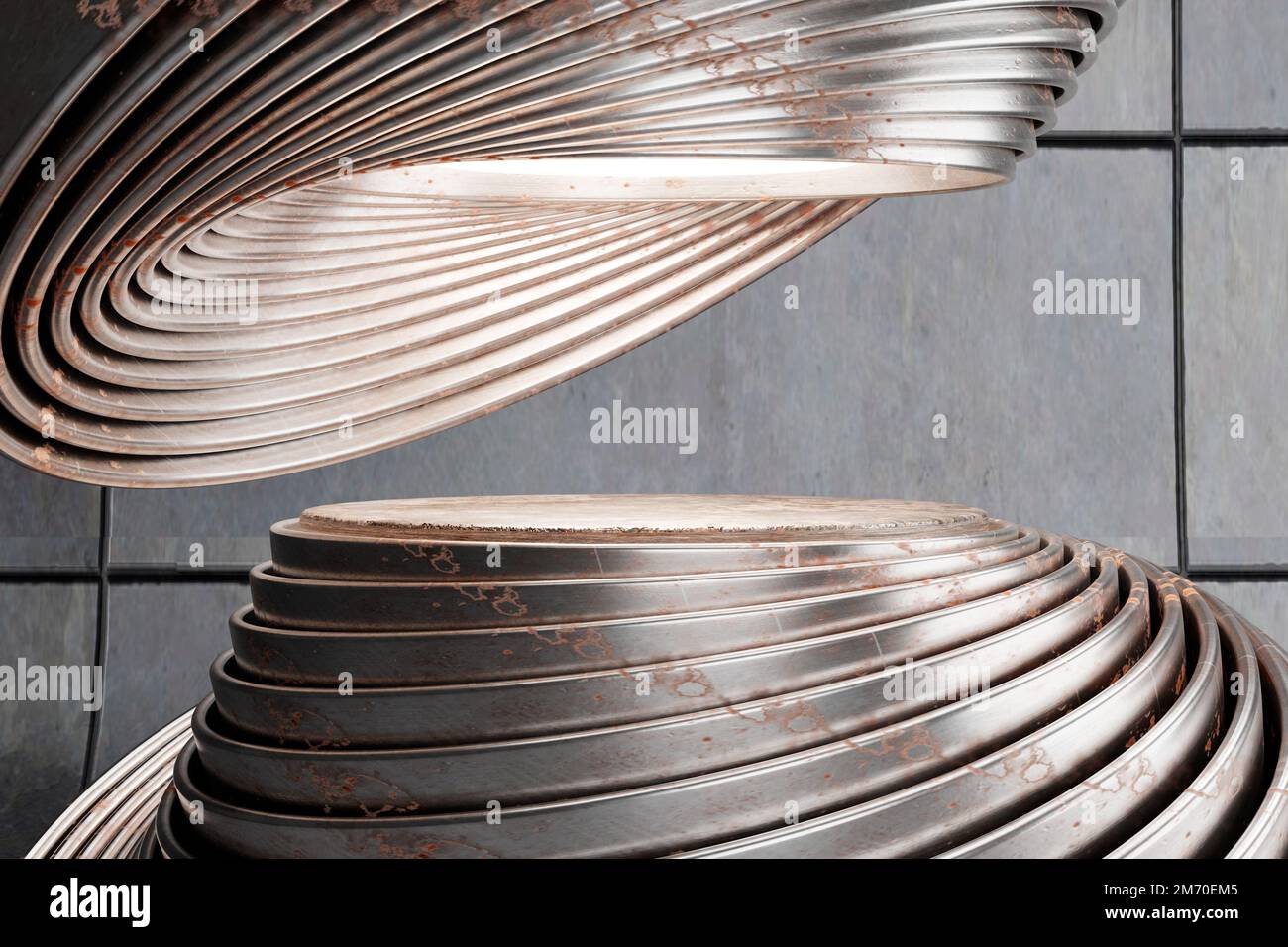 An image of two shiny dark grey round objects with layers and a light ...