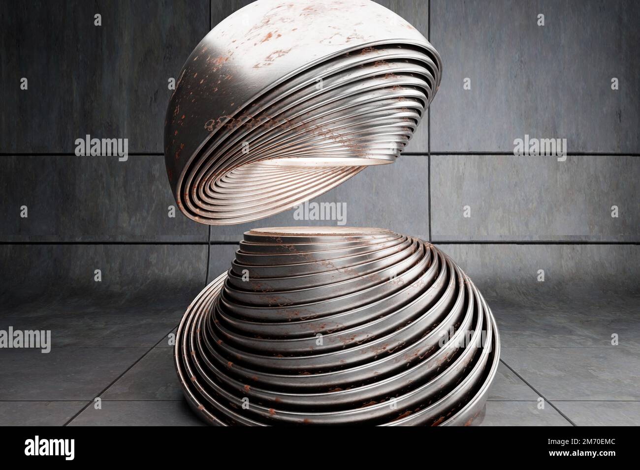 An image of two shiny dark grey round objects with layers and a light ...