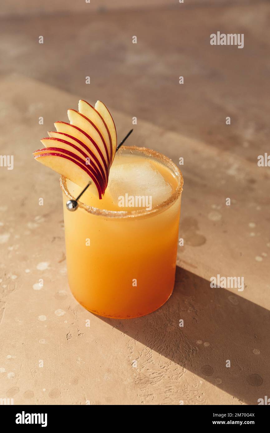 Spiced apple drink with sliced apple garnish Stock Photo - Alamy