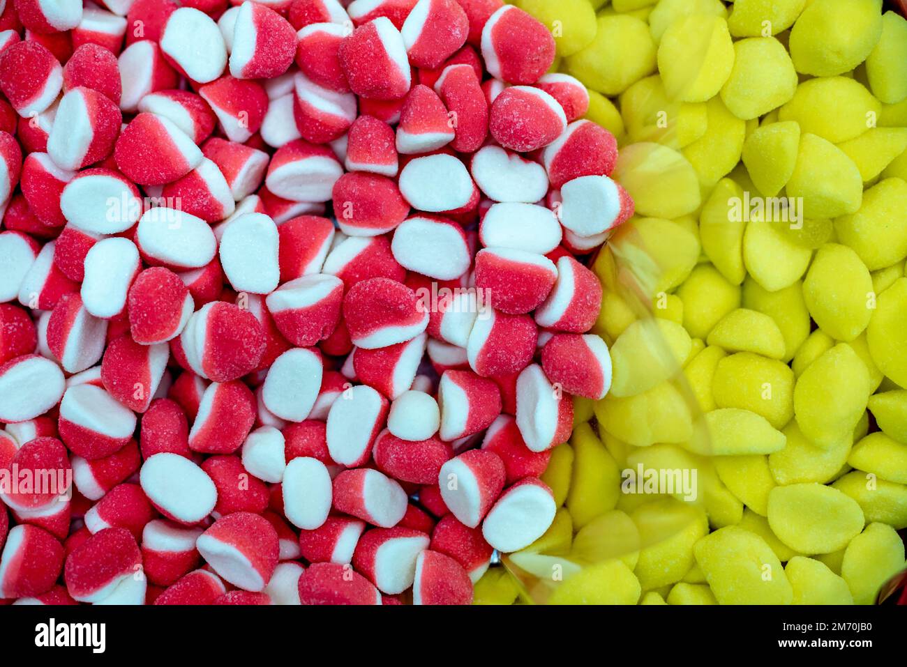 many colored marmalade candies laid out on a flat surface; dessert for ...