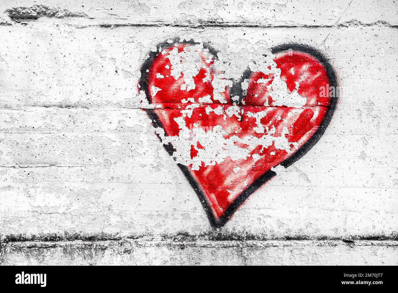 Painted red abstract heart shape love symbol, dirty wall background ...