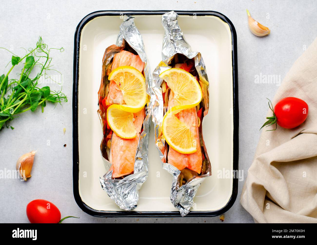 Baked Salmon in Foil, Cooked Fish with Vegetables in a baking dish ...