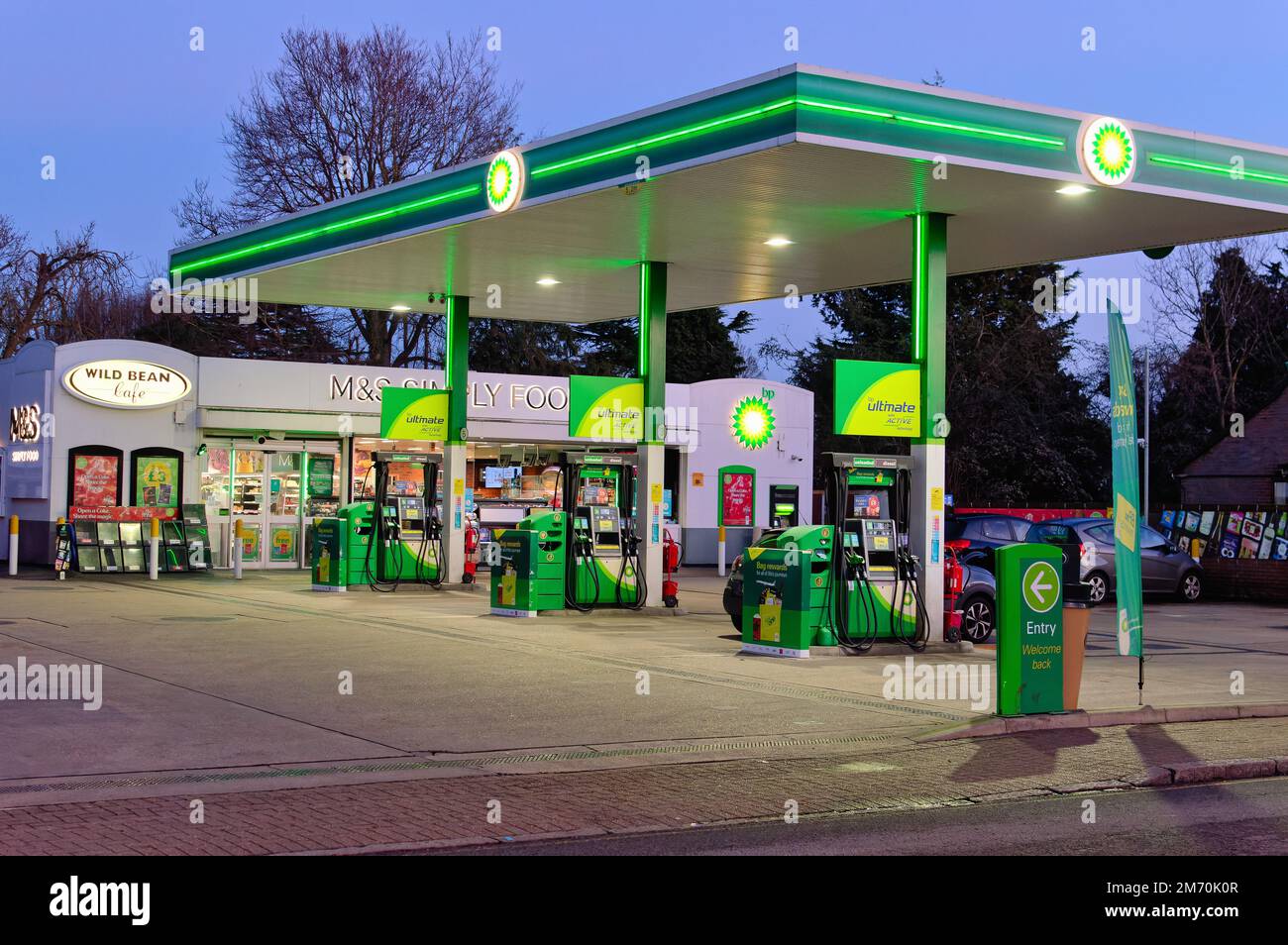 The forecourt of the BP petrol station at dusk with a Marks and Spencer ...