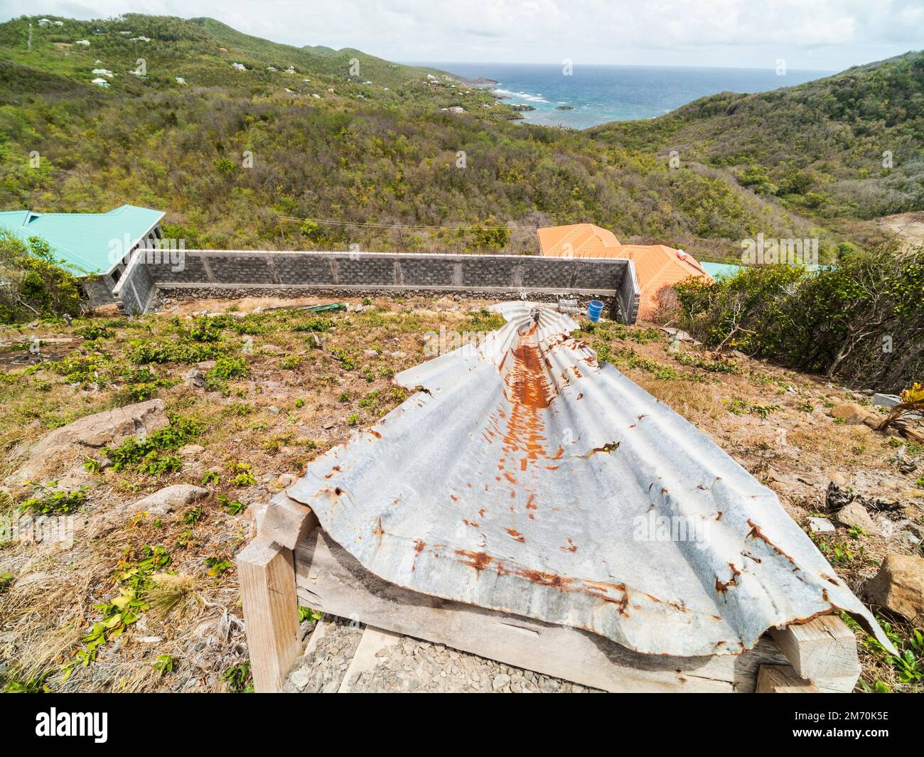 A chute placed on steep ground in Bequia for building materials ...