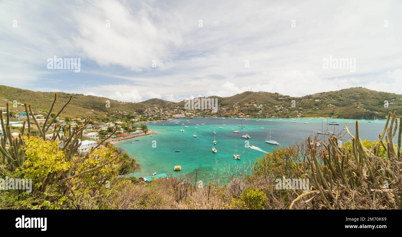 Bequia, Admiralty Bay, Hamilton. Village with old cannon emplacement ...