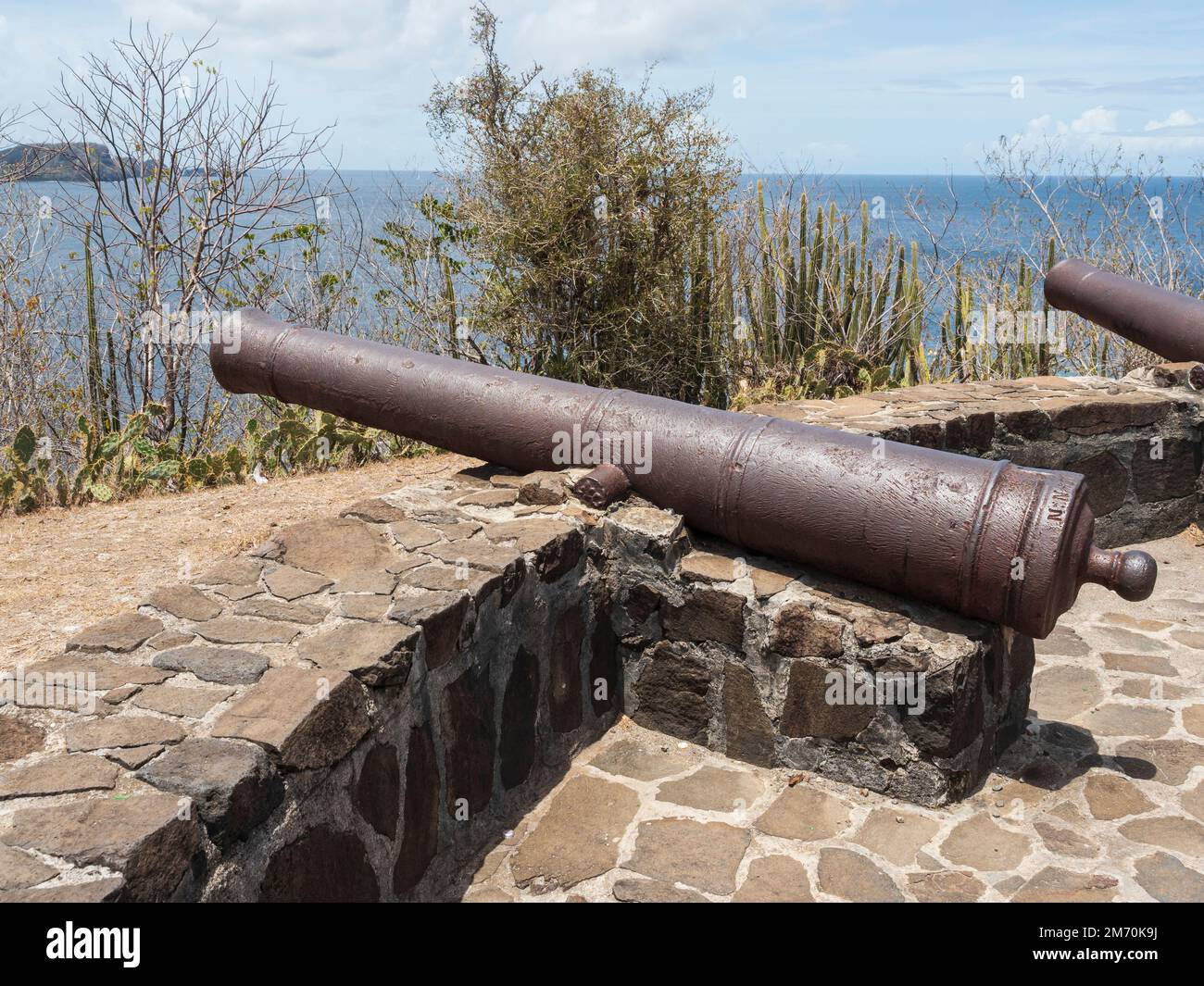 Bequia, Admiralty Bay, Hamilton. Village with old cannon emplacement ...