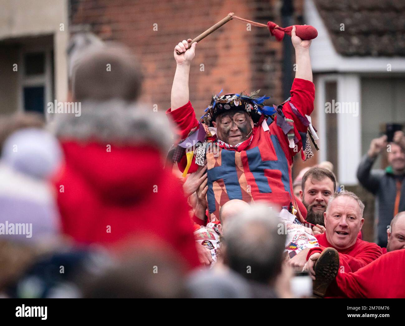 The ceremonial fool, James Chatwin, is carried through the village ...