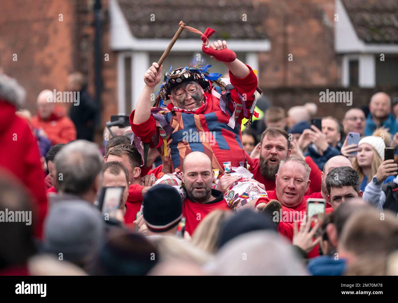 The ceremonial fool, James Chatwin, is carried through the village ...