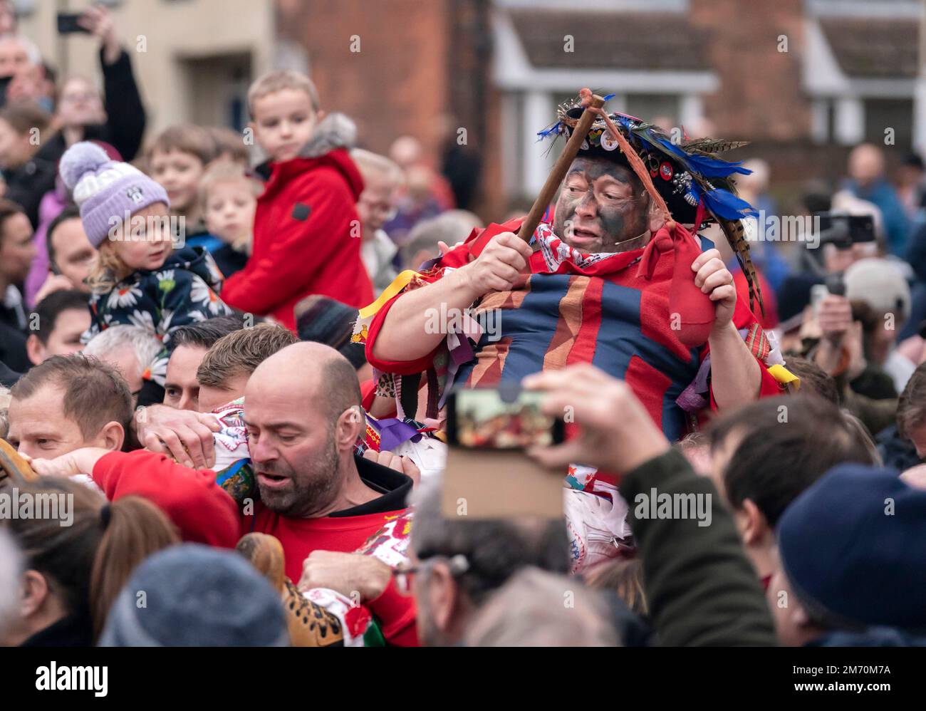 The ceremonial fool, James Chatwin, is carried through the village ...