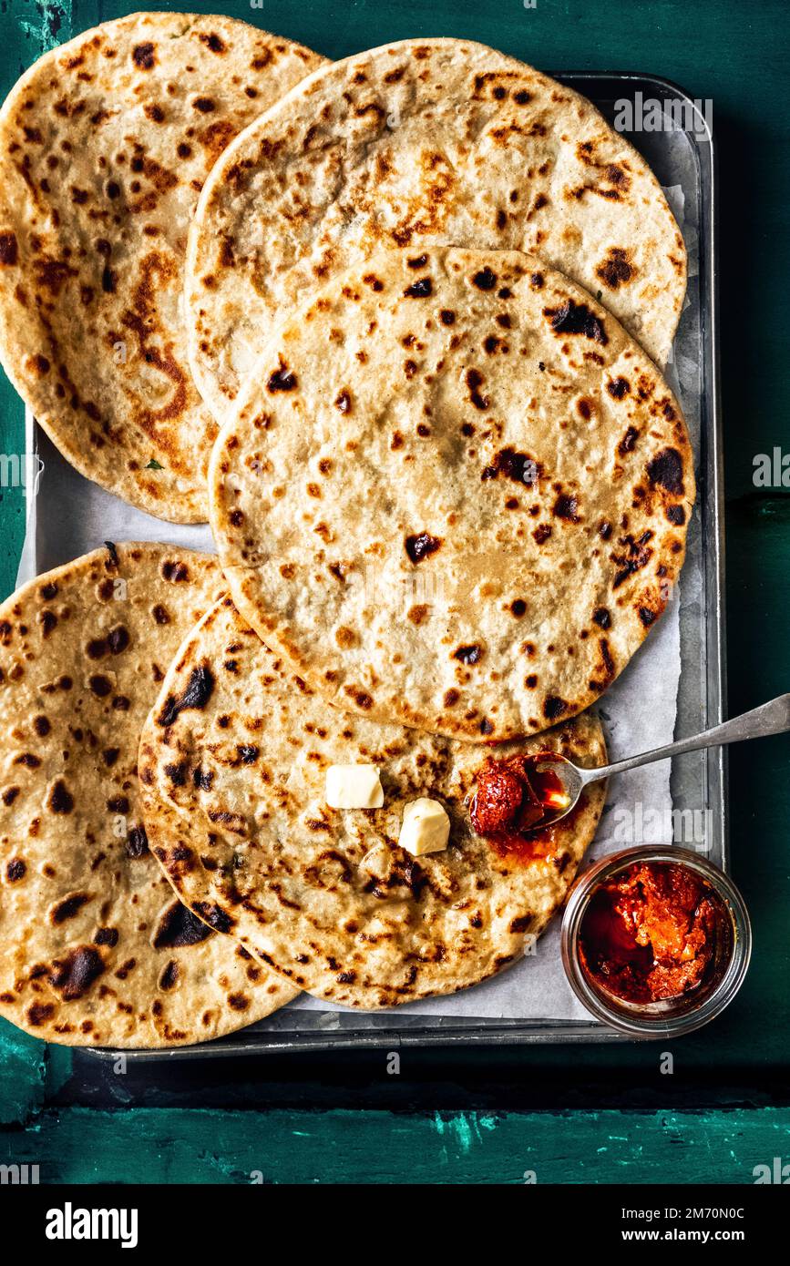 Flatlay of stuffed Aloo paratha Indian potato flatbread Stock Photo - Alamy