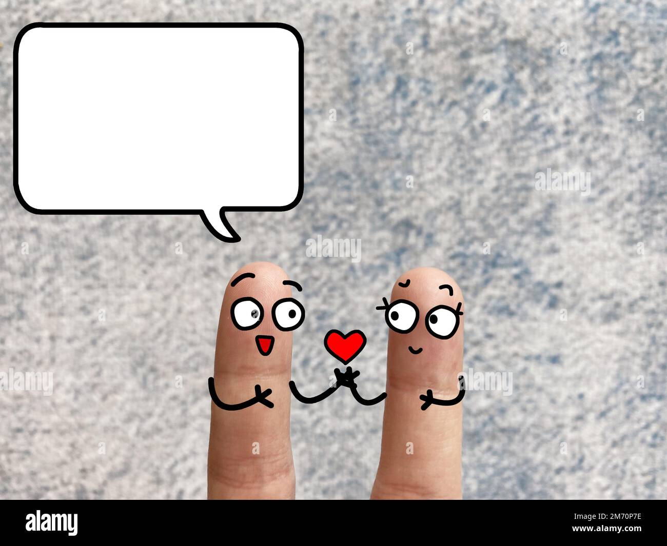 Two fingers are decorated as two person. One of them is asking another if she will marry him ...