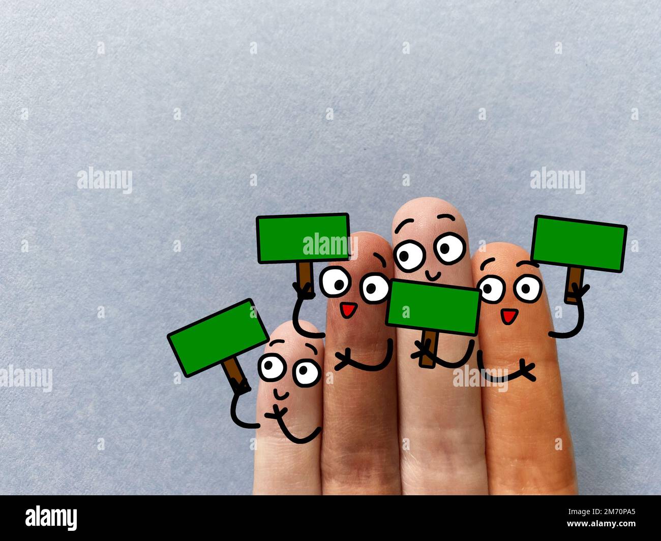 Four fingers are decorated as four person with different skin color ...