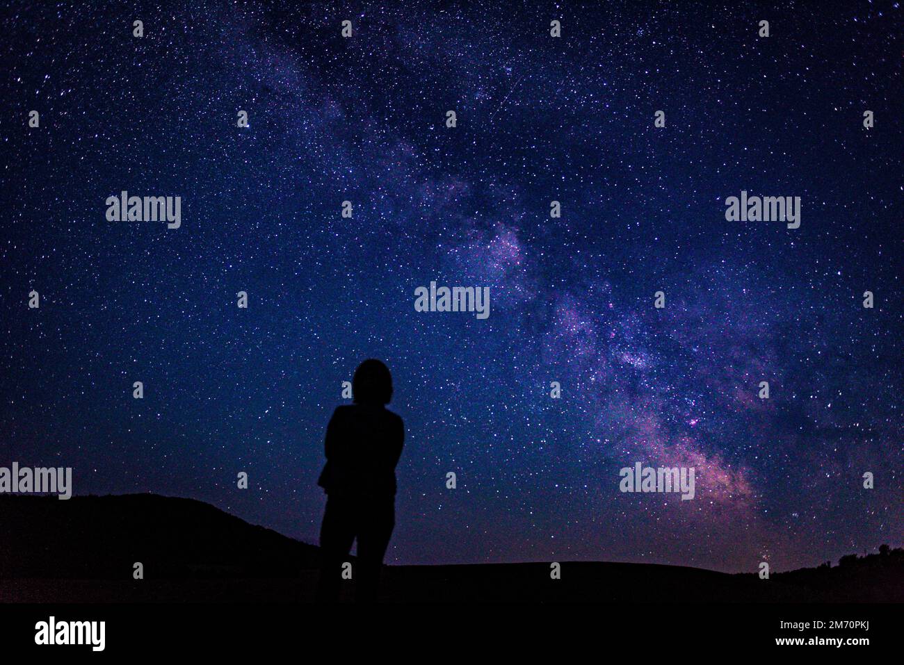 the woman looks at the milky way Stock Photo - Alamy