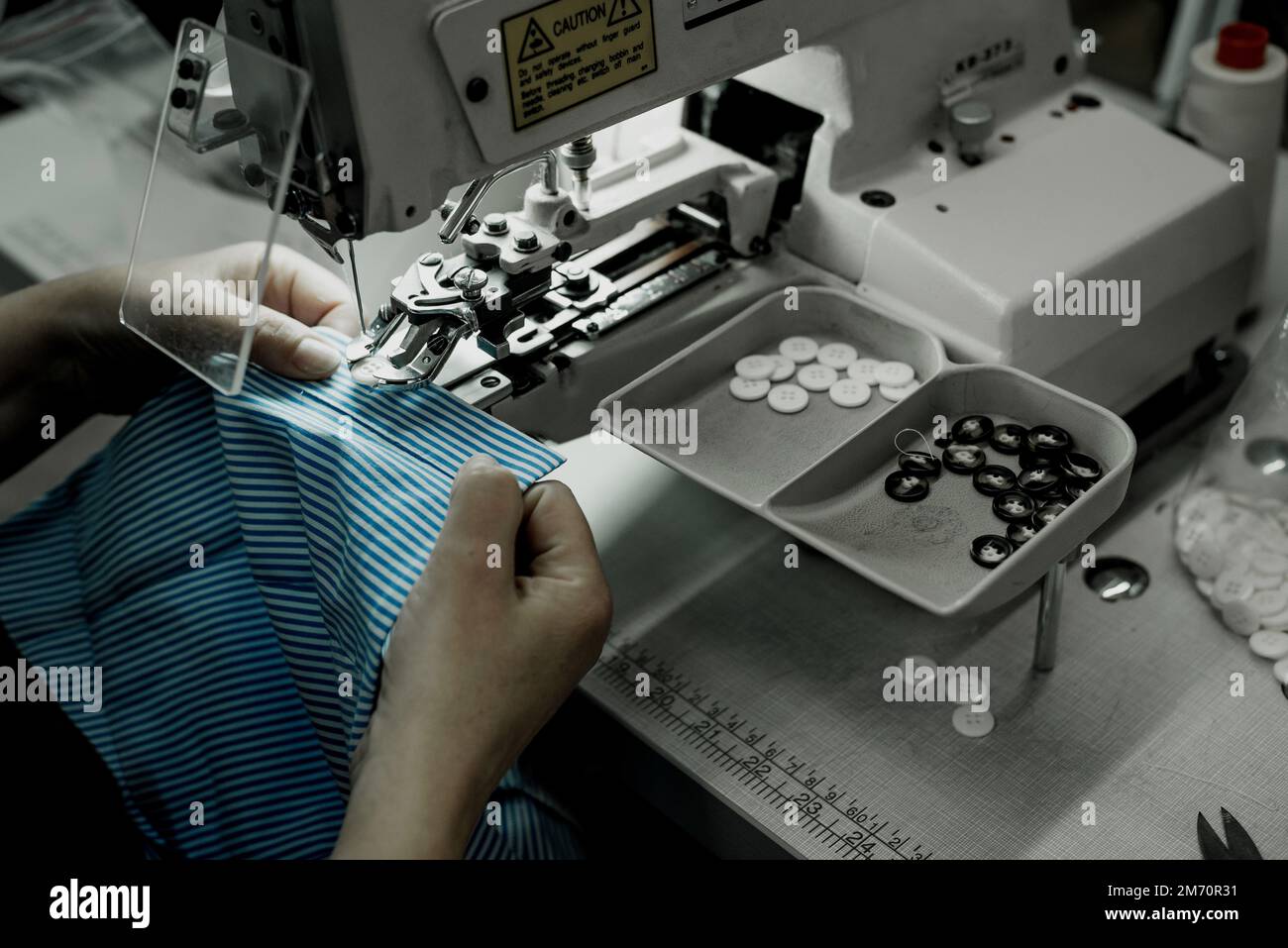 production of women's summer clothes; manufacturing process at a light ...