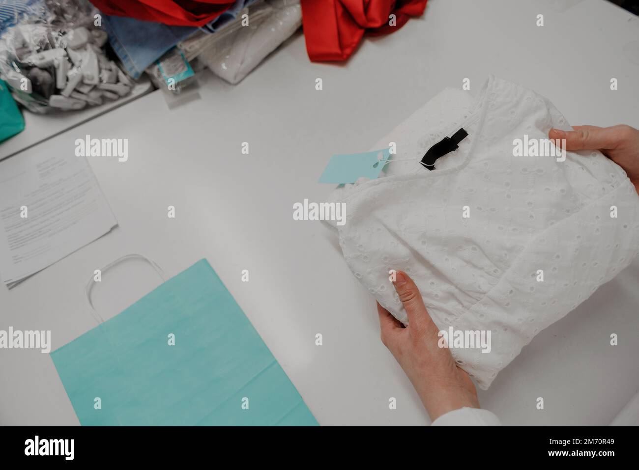 production of women's summer clothes; manufacturing process at a light ...