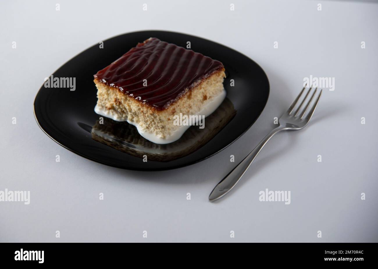 Turkish light dairy dessert trileche Stock Photo - Alamy