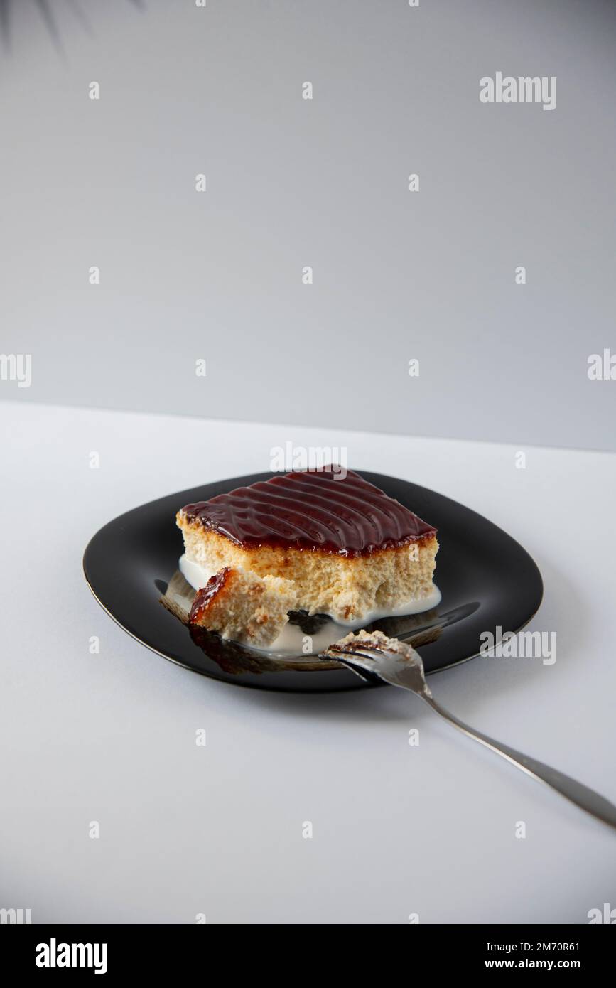 Turkish light dairy dessert trileche Stock Photo - Alamy