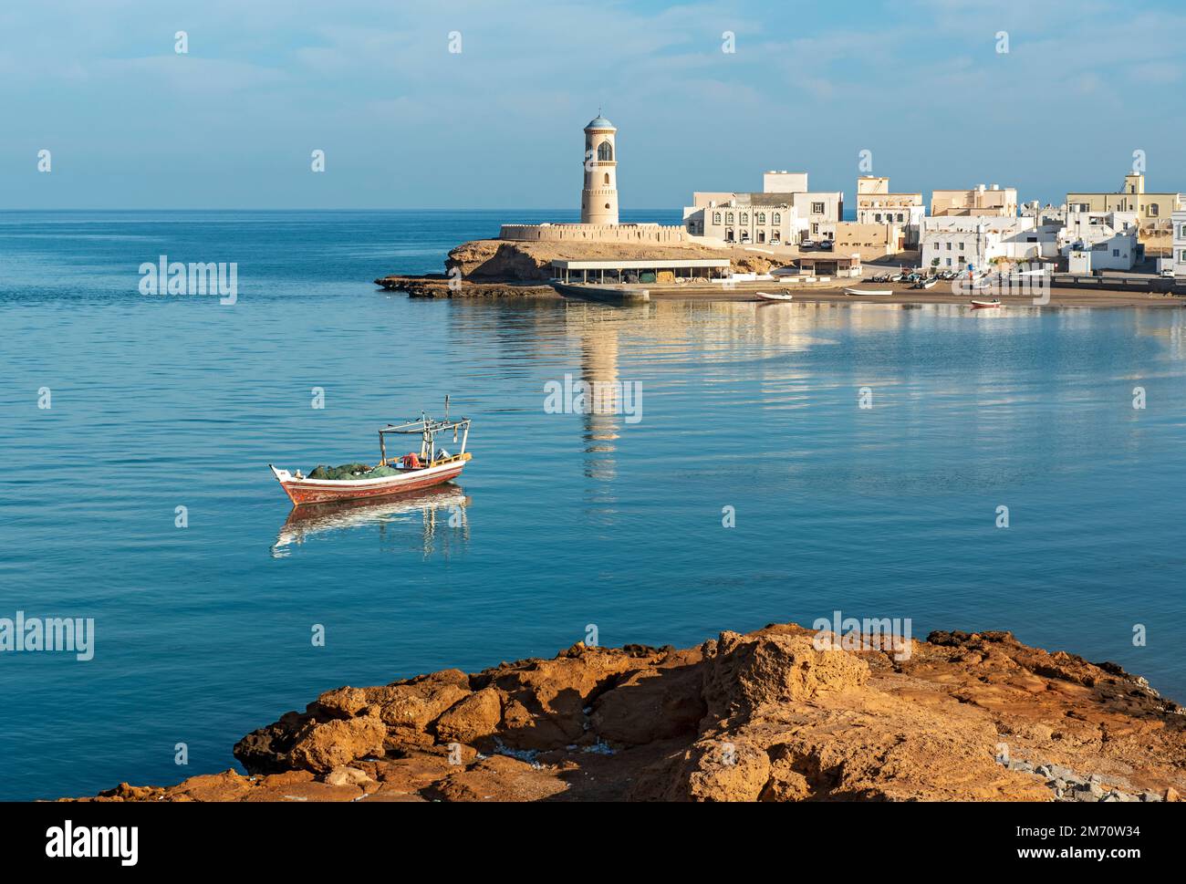 Fishing boat and Al-Ayjah Lighthouse, Sur, Oman Stock Photo - Alamy