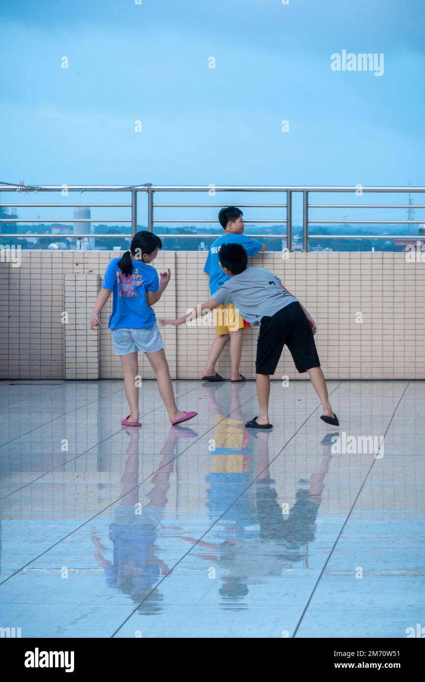 children playing on a rooftop Stock Photo - Alamy