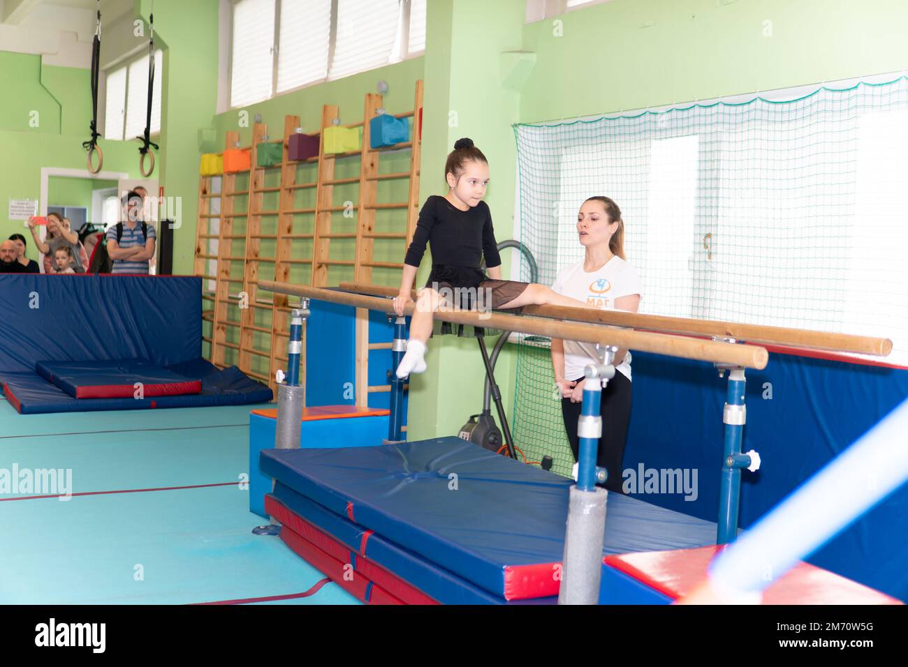 MOSCOW, RUSSIA-DEC 18, 2022: people uneven exercise competition gymnast ...