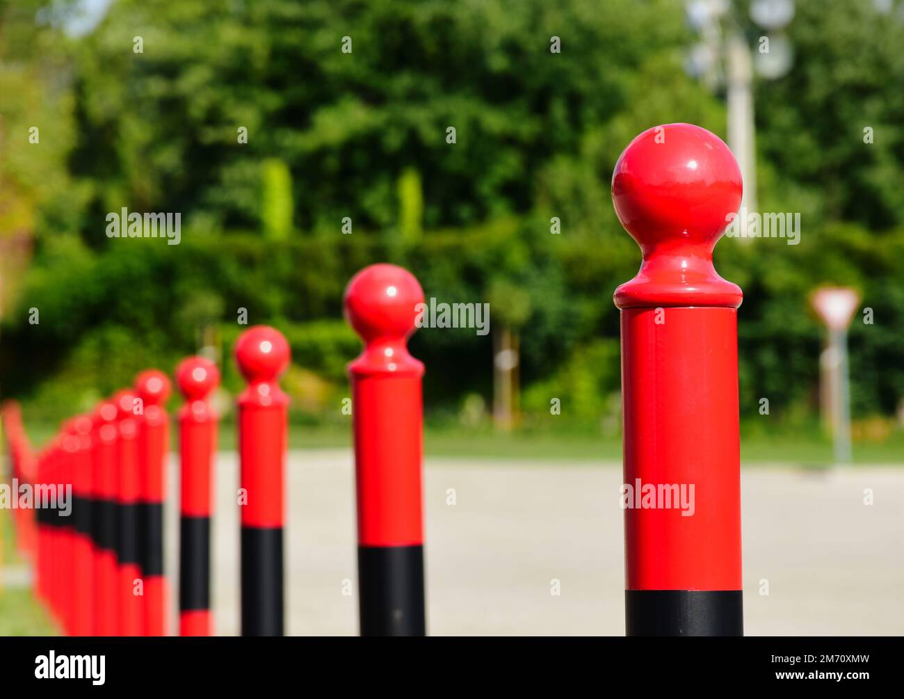 red steel bollards or posts. closeup detail view. sphere shape post ...