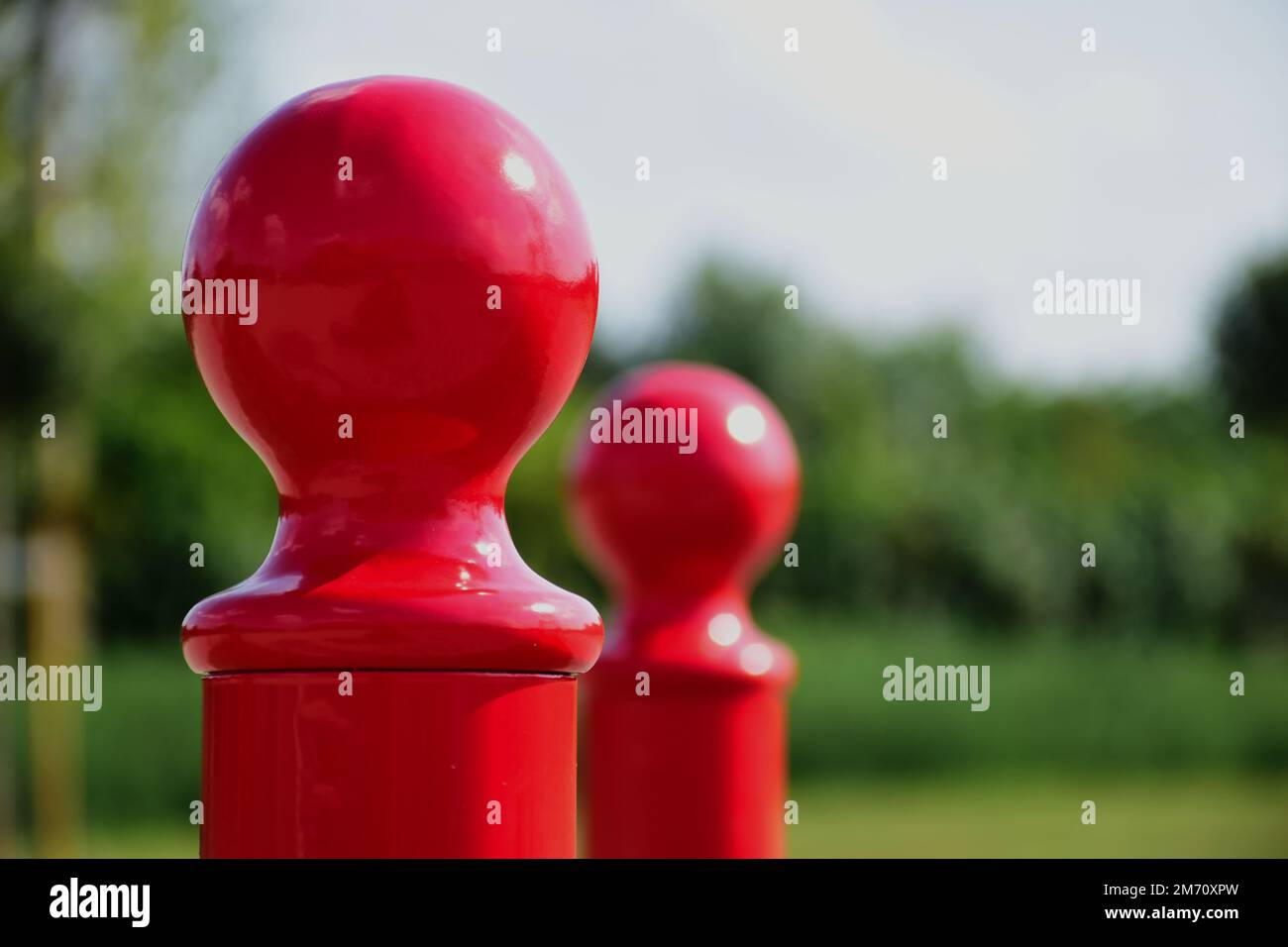 red steel bollards or posts. closeup detail view. sphere shape post ...