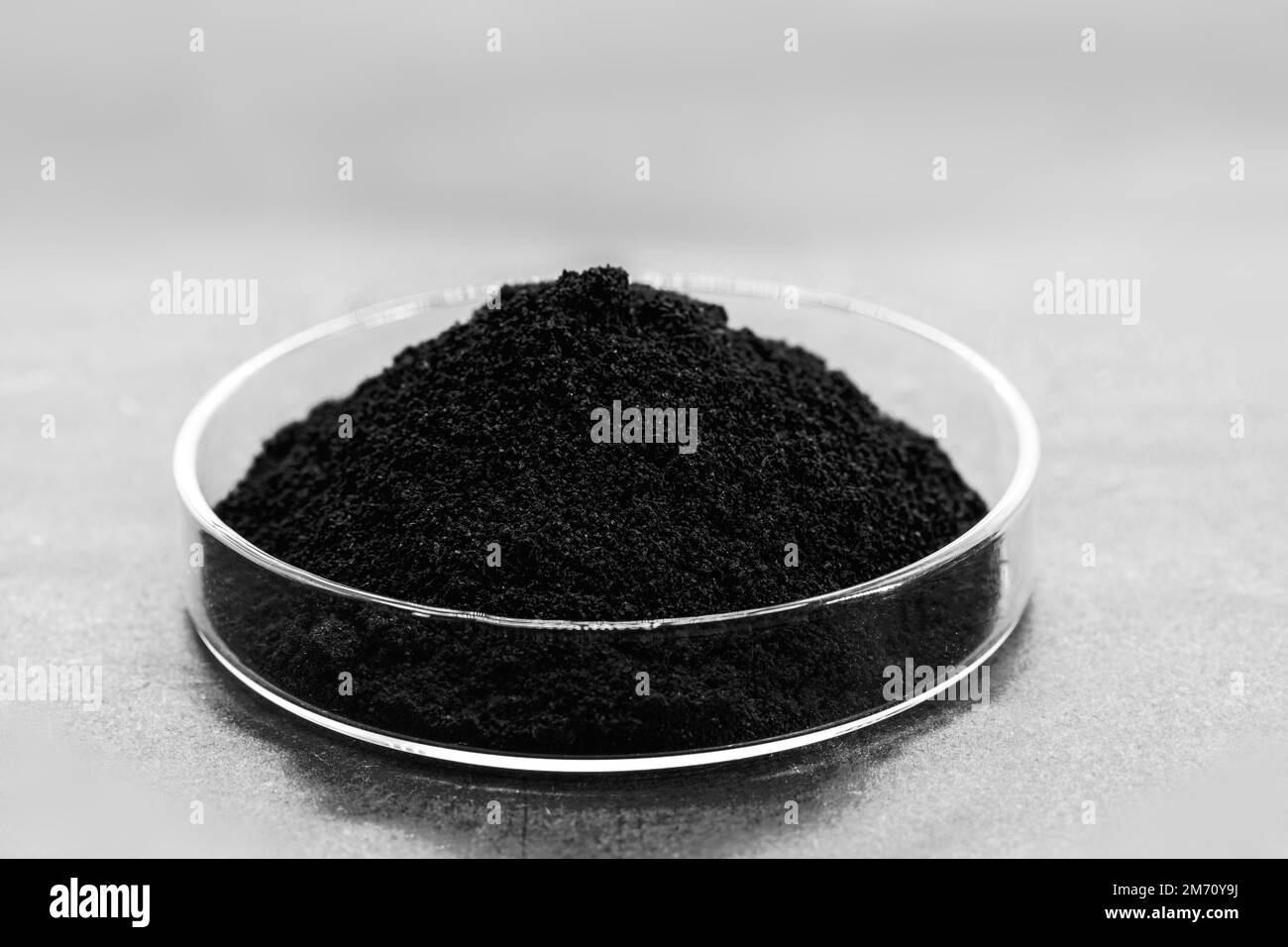 Petri dish with graphene powder, material is light, electrically ...