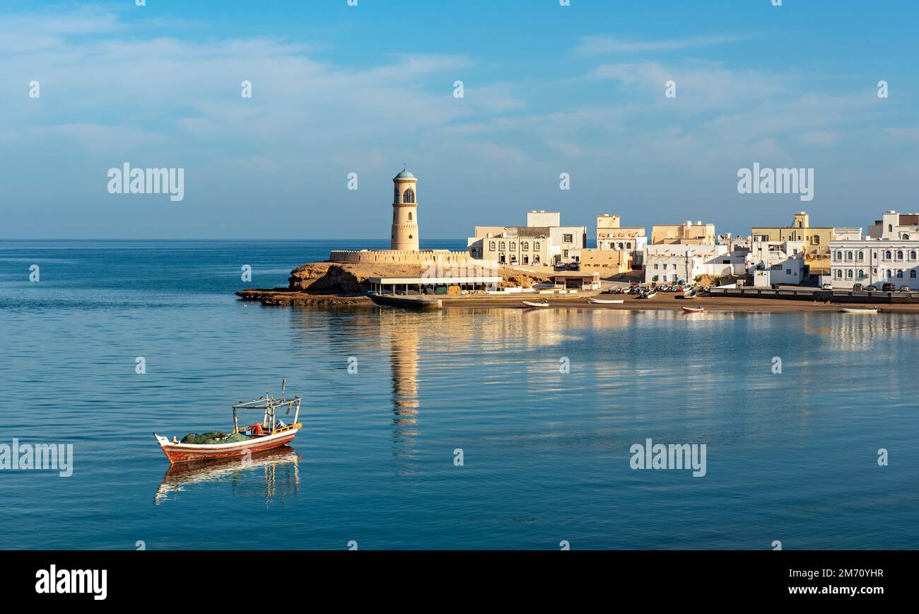 Fishing boat and Al-Ayjah Lighthouse, Sur, Oman Stock Photo - Alamy