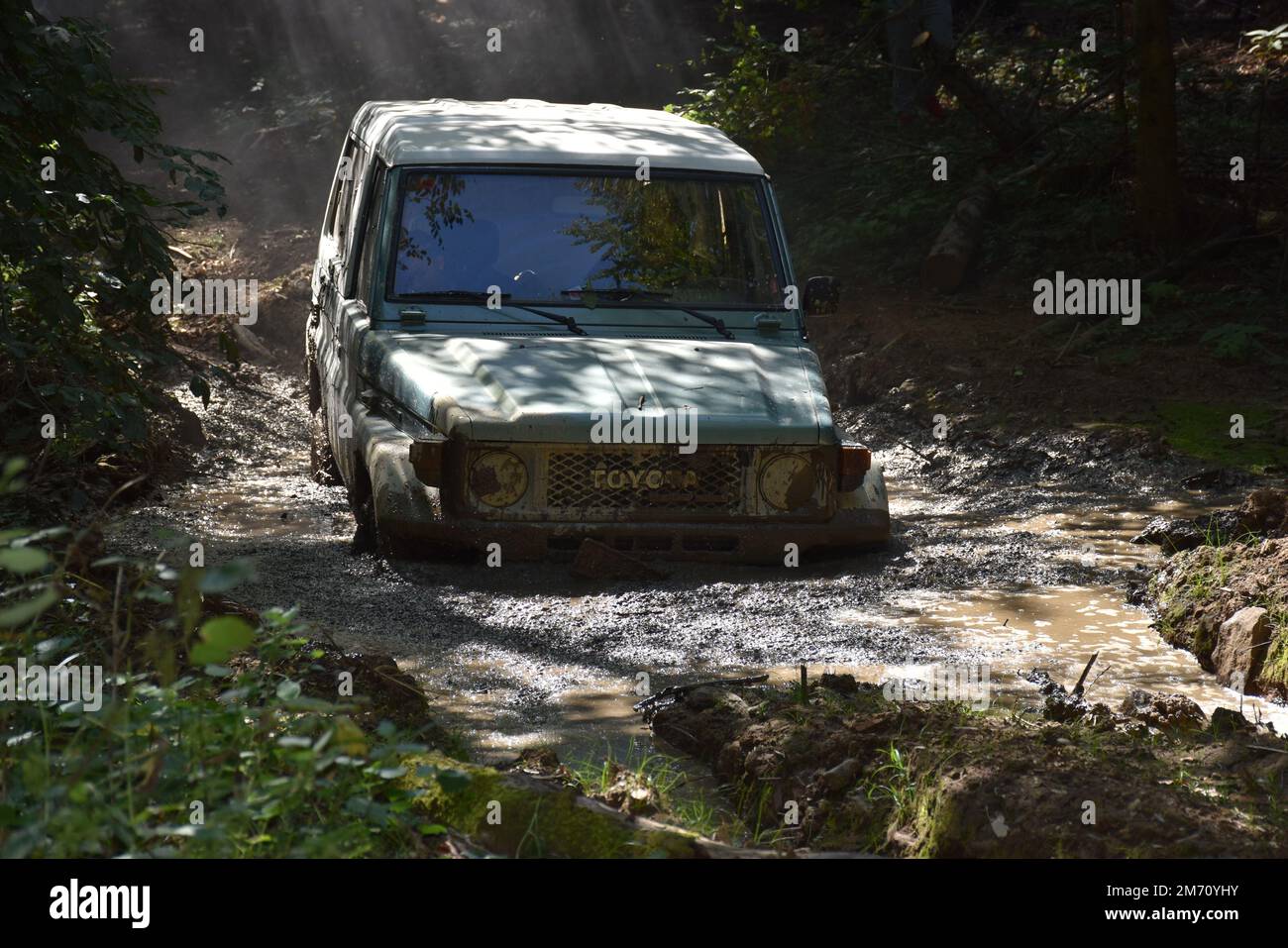Escape from mud with my Toyota Stock Photo - Alamy