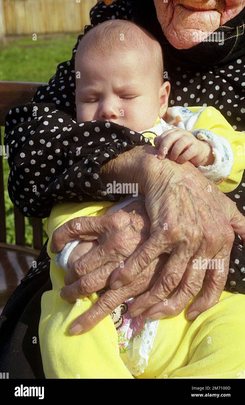 Mures County Romania Approx 2001 Great Grandmother Holding Her Great Granddaughter In Her