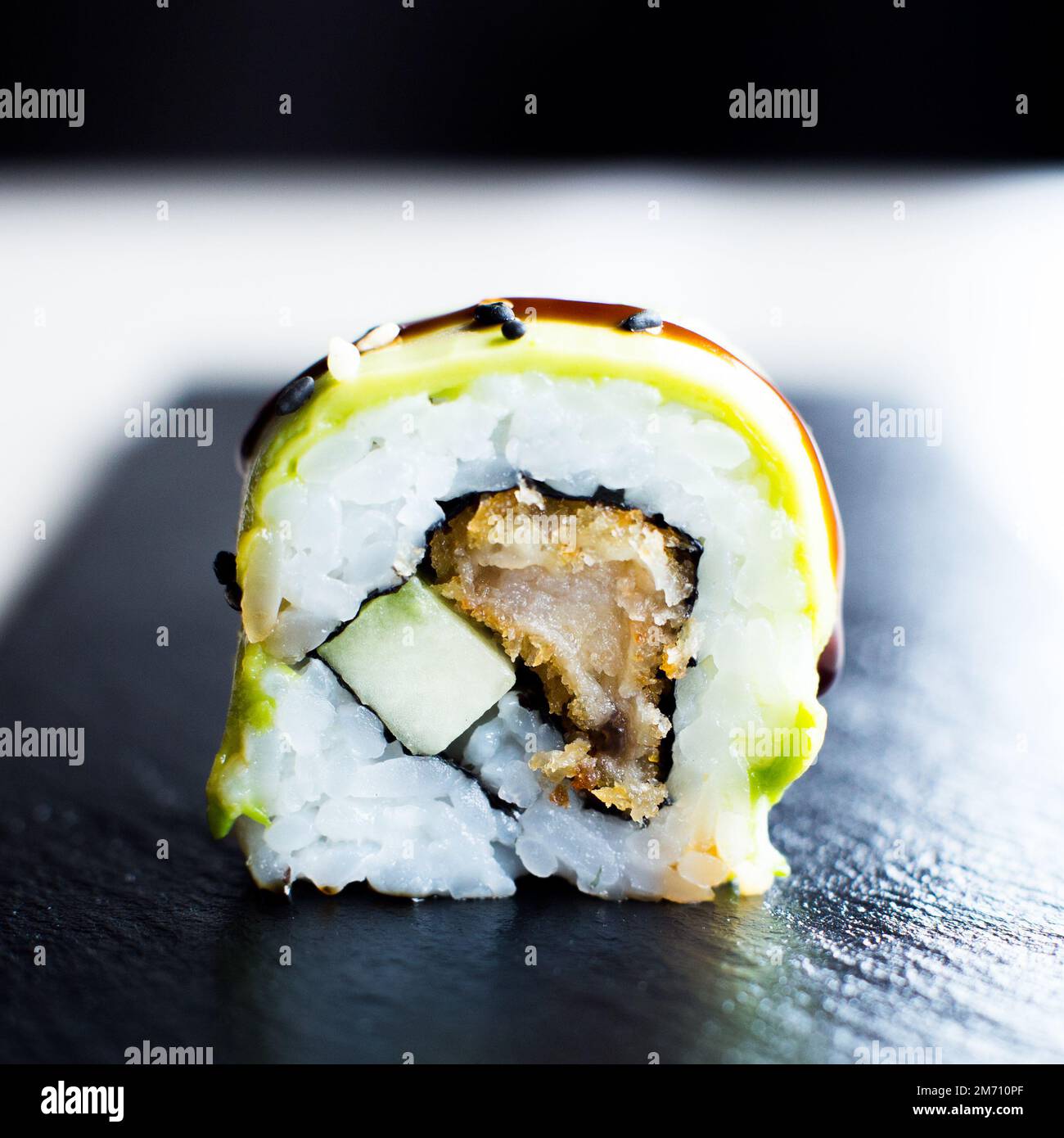 Chicken Uramaki with avocado. Sushi made with premium rice combined ...