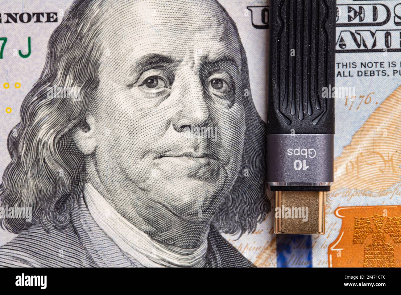 100 dollar banknote with black USB Type-C cord for design purpose Stock ...
