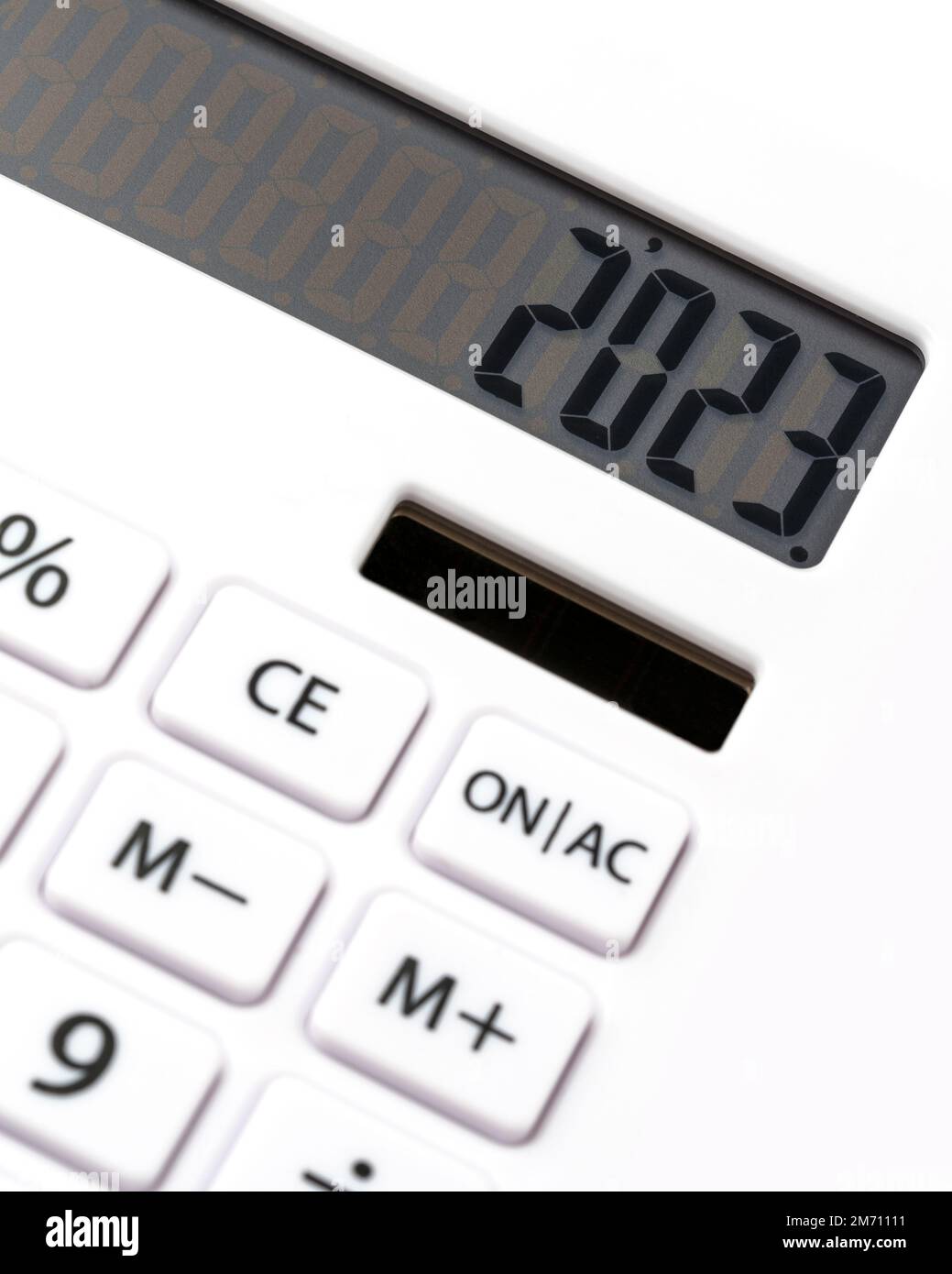 A white calculator with 2023 on the screen. A concept for recording ...